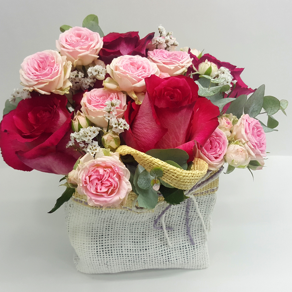 Mix of Pink Roses and baby roses in jute b | WeDeliverGifts